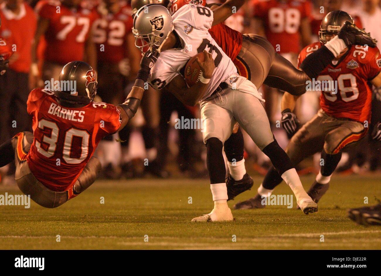Bucs Darian Barnes #30 grabs hold of Joe Jurevicius #83 in the third ...