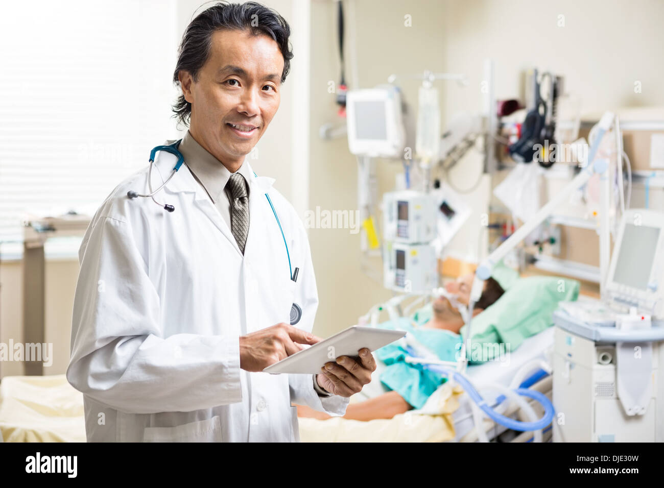 Doctor With Digital Tablet Examining Patient's Test Report Stock Photo ...