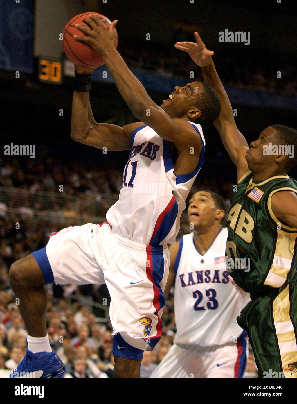 Mar 26, 2004; St. Louis, MO, USA; Kansas' AARON MILES drives Friday ...
