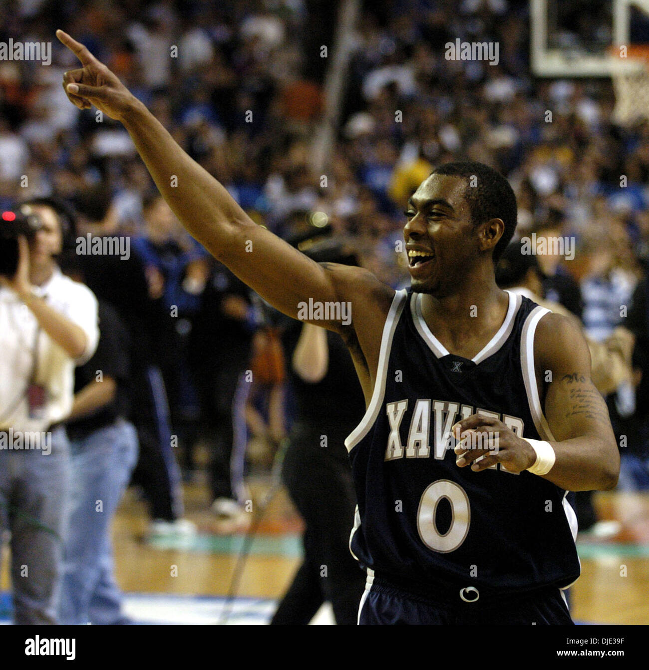 Mar 26, 2004; Atlanta, GA, USA; Xavier's LIONEL CHALMERS celebrates ...
