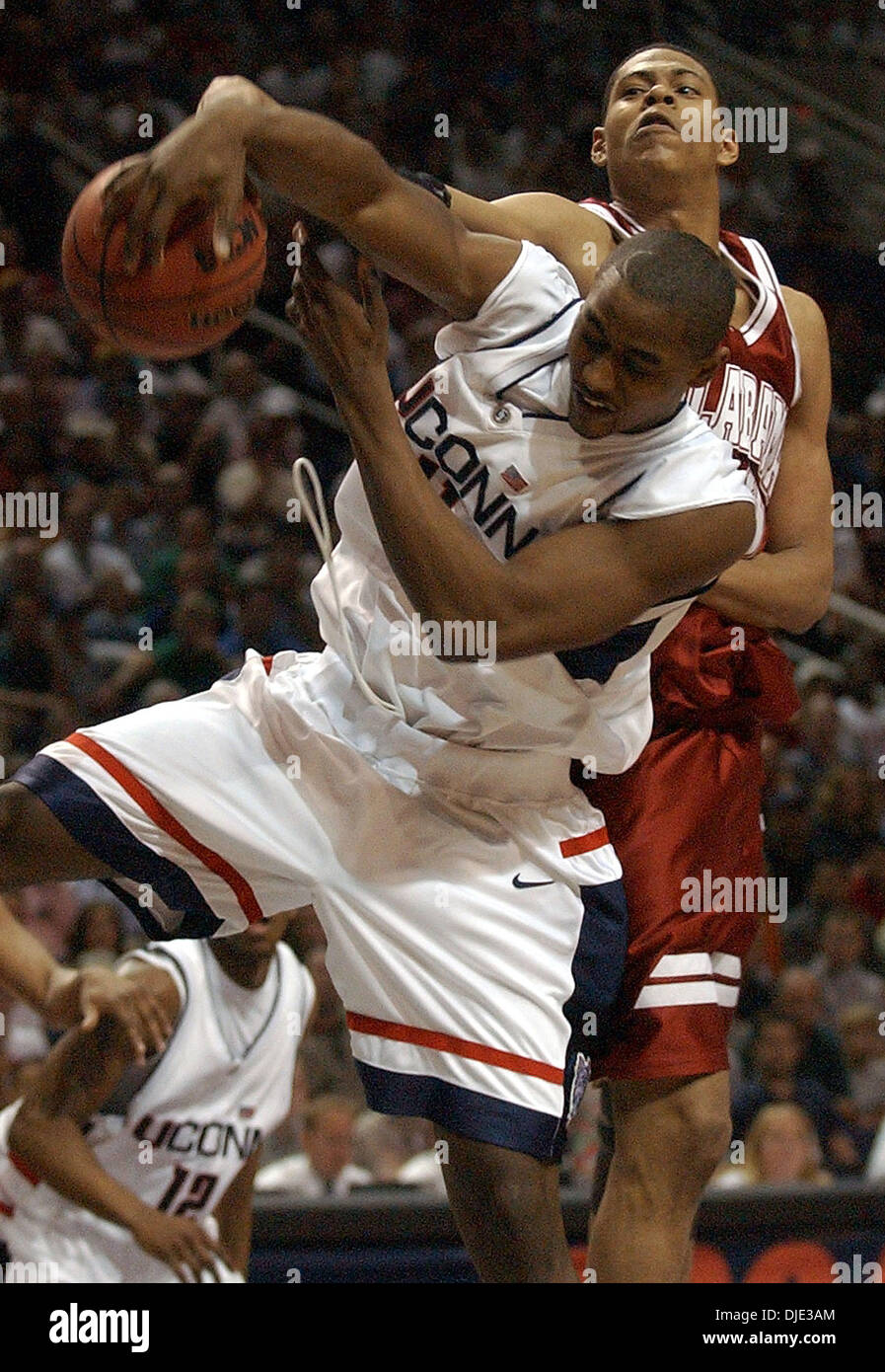 Mar 27, 2004; Phoenix, AZ, USA; UConn's HILTON ARMSTRONG snags a ...
