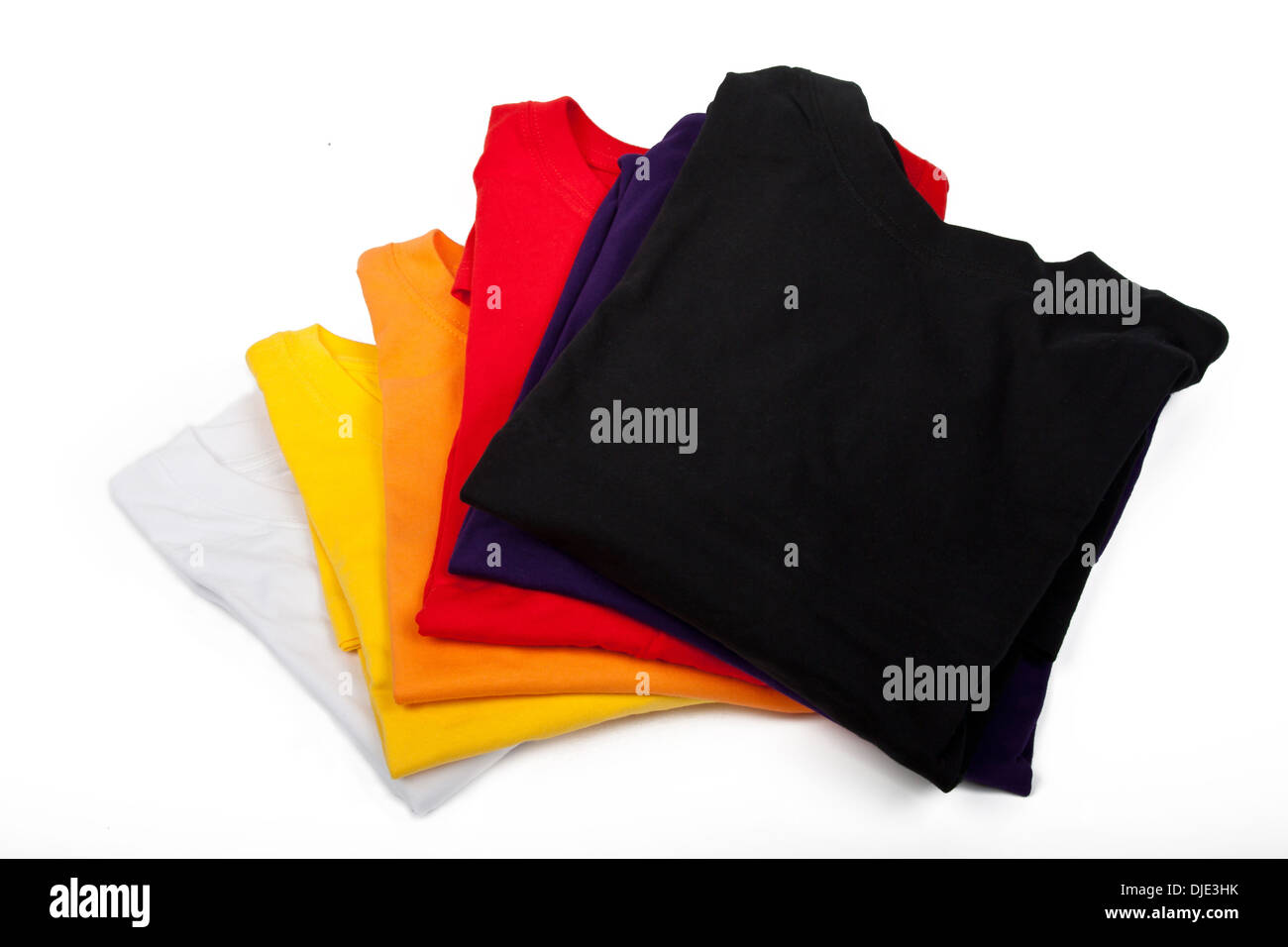 a stack of t-shirts isolated on white background Stock Photo - Alamy