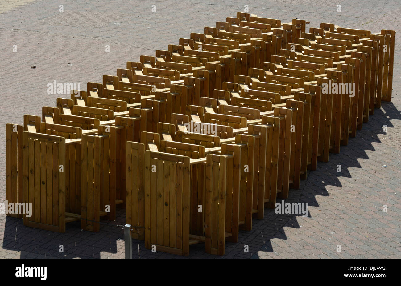 Stack of tables with benches on seafront promenade. Brighton. East ...