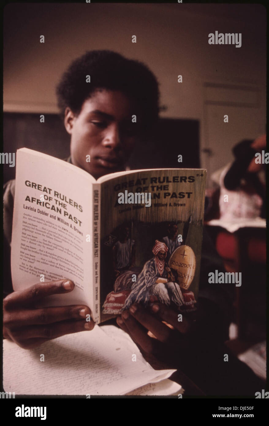 A Black student in a Black studies class on Chicago's West Side reads a ...