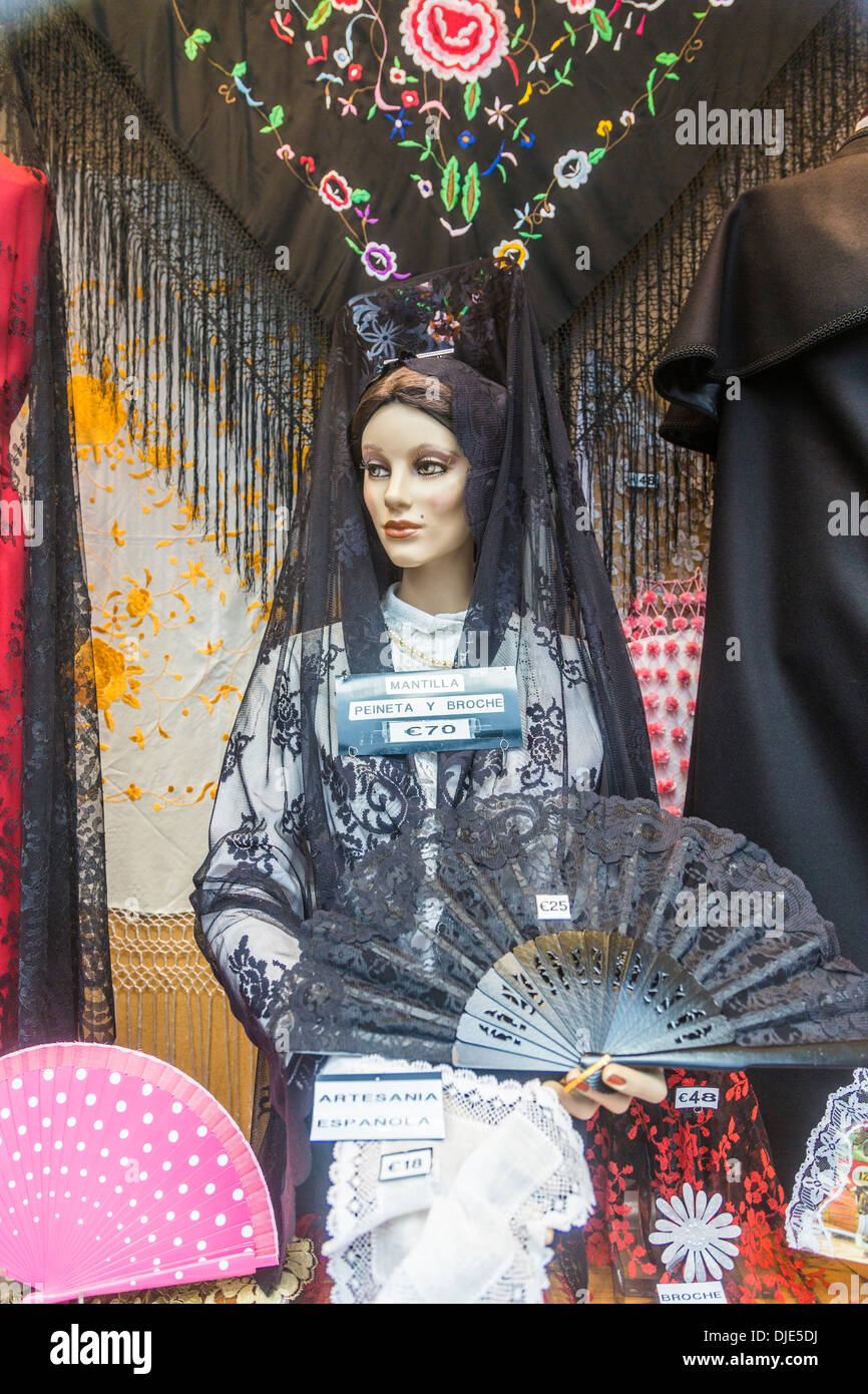 Mannequin in Madrid shop window in traditional dress, with scarves and ...