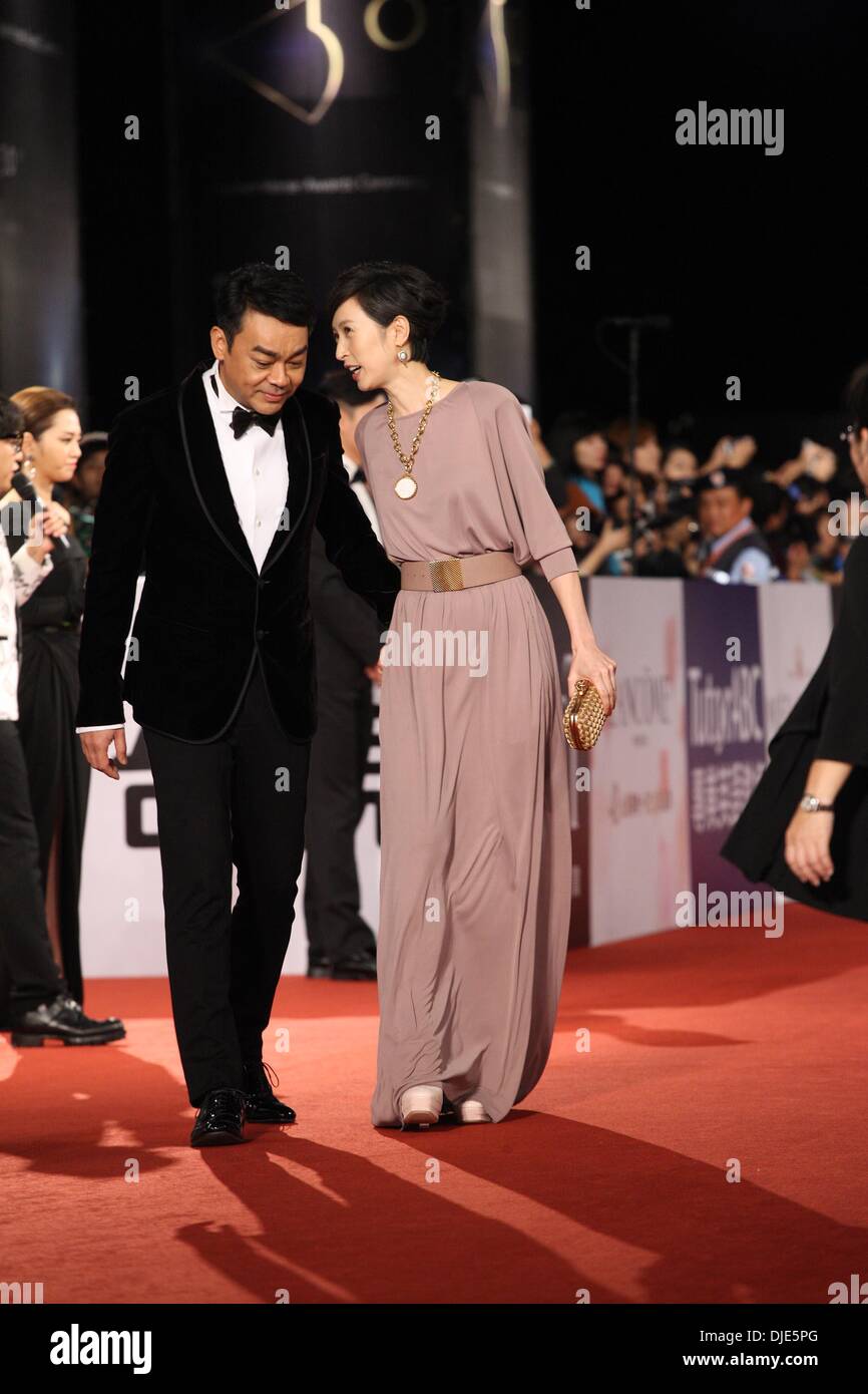 Taipei, China. 23rd Nov, 2013. Sean Andy and wife Amy Kwok arrive at ...