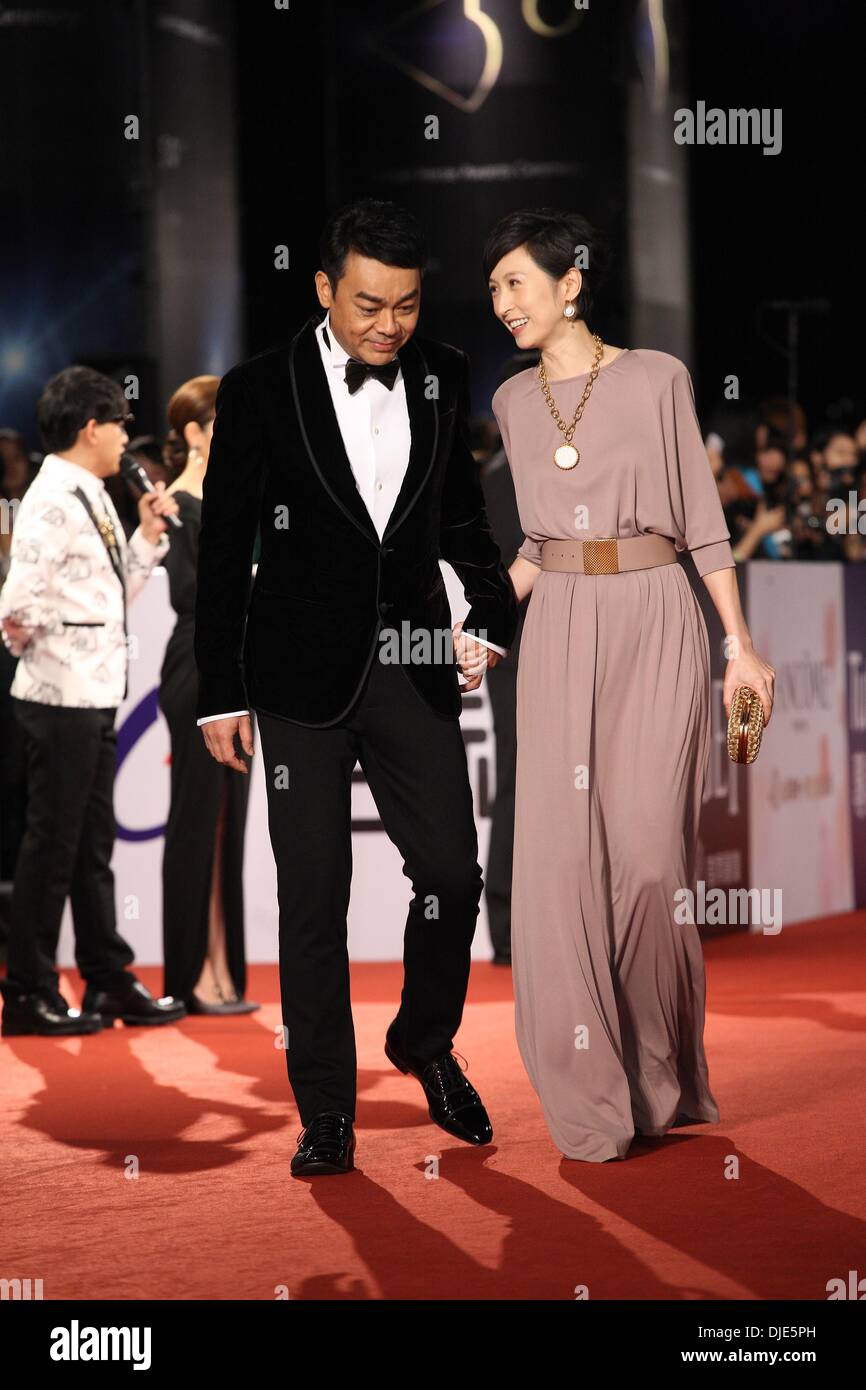Taipei, China. 23rd Nov, 2013. Sean Andy and wife Amy Kwok arrive at ...
