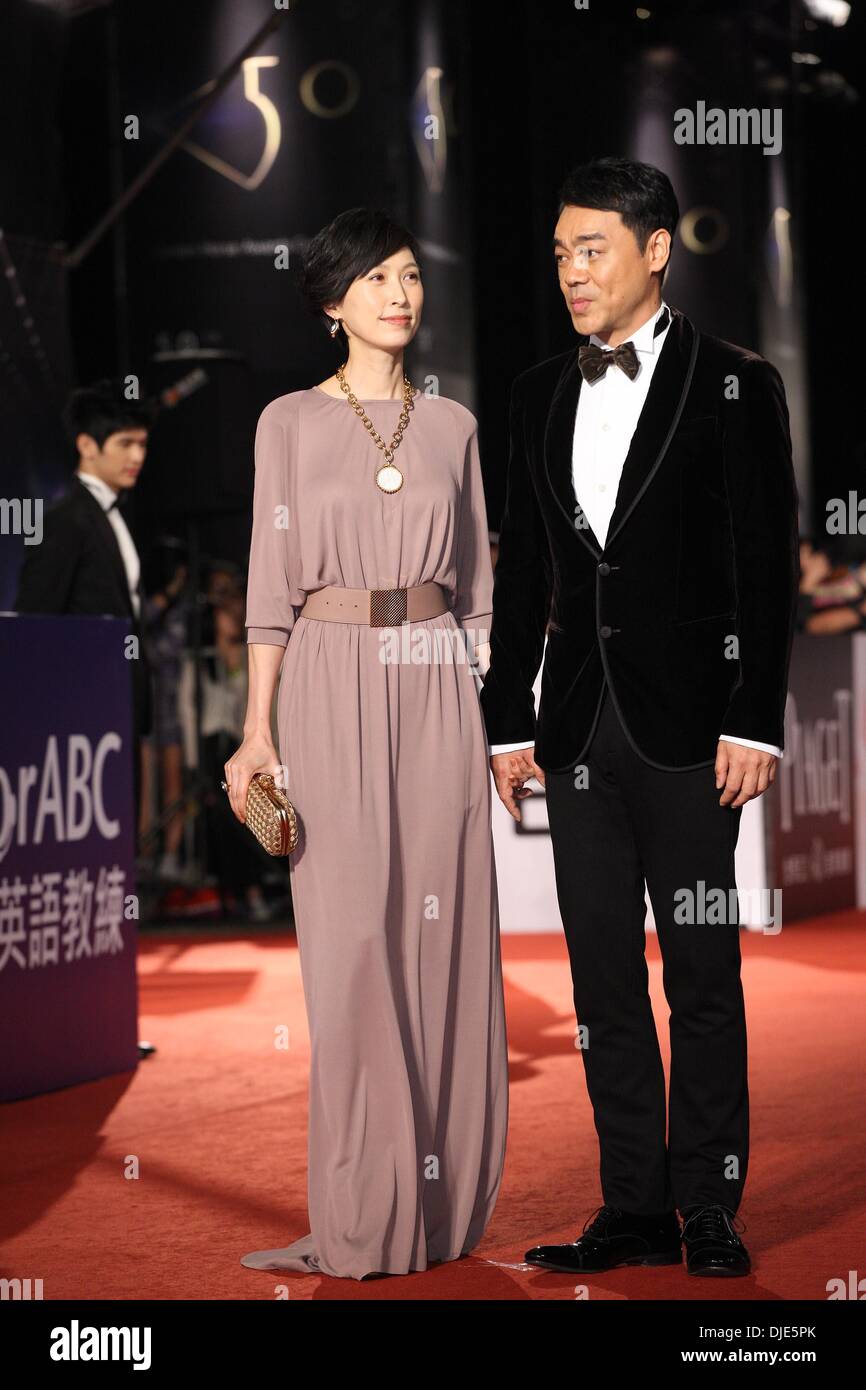 Taipei, China. 23rd Nov, 2013. Sean Andy and wife Amy Kwok arrive at ...