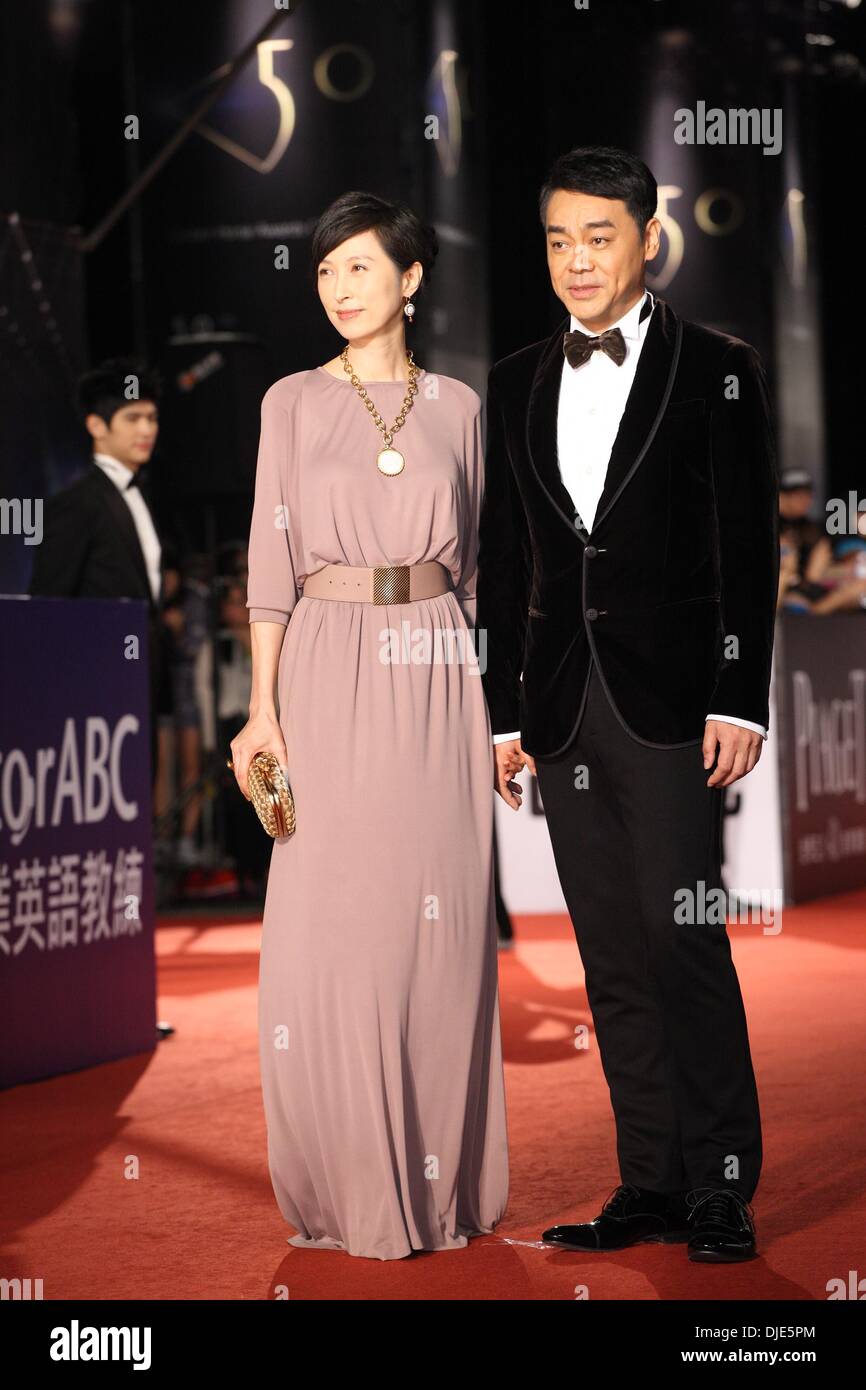 Taipei, China. 23rd Nov, 2013. Sean Andy and wife Amy Kwok arrive at ...
