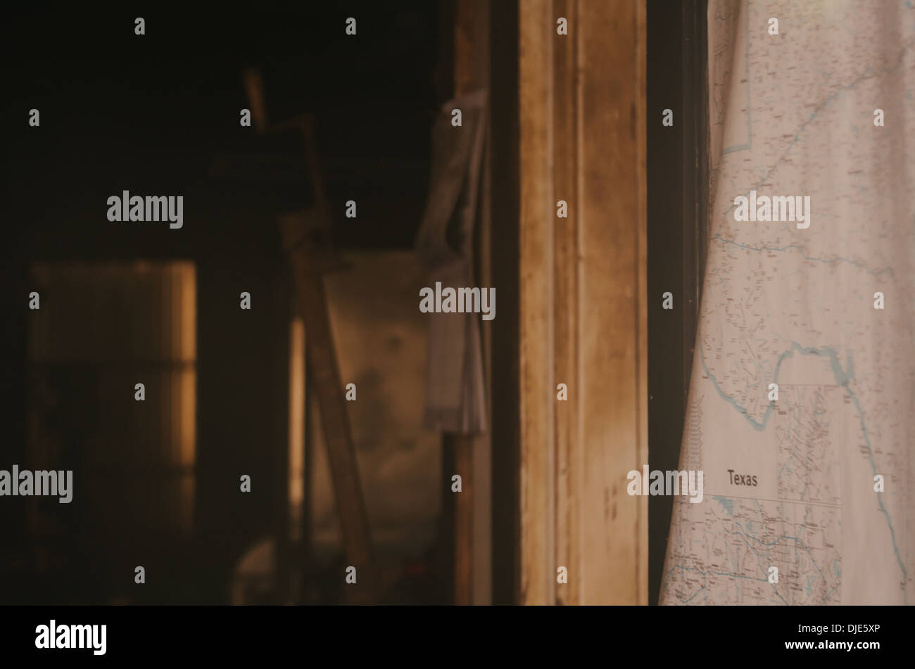 Abandoned old warehouse with Texas map hanging on the wall. Blanco ...