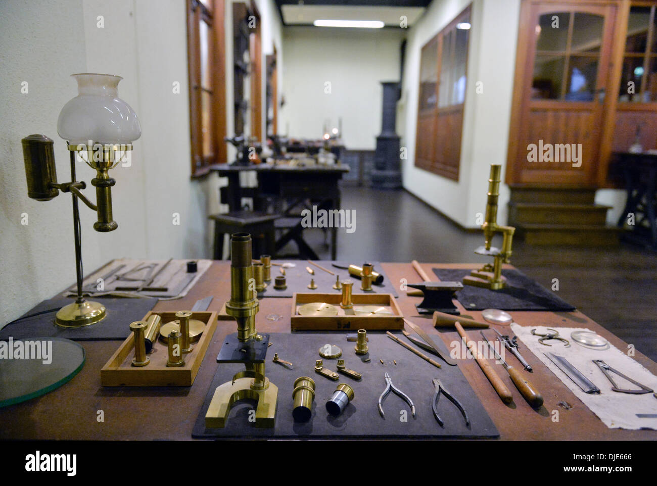 Jena, Germany. 21st Nov, 2013. Tools and components for microscopes lie ...