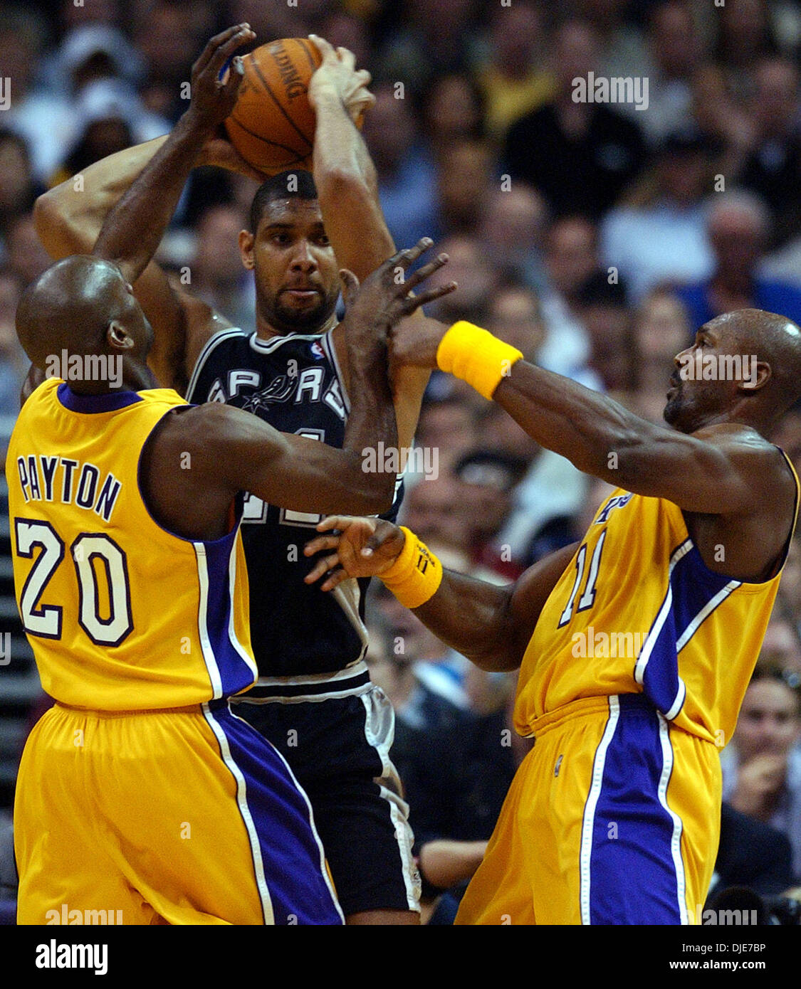 May 11, 2004; Los Angeles, CA, USA; Spurs' TIM DUNCAN looks to pass ...