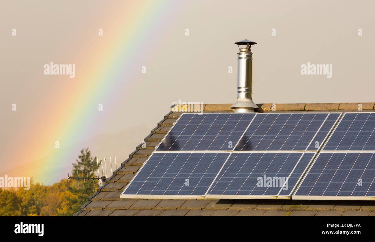 A rainbow over a house in Ambleside, with solar panels on the roof ...