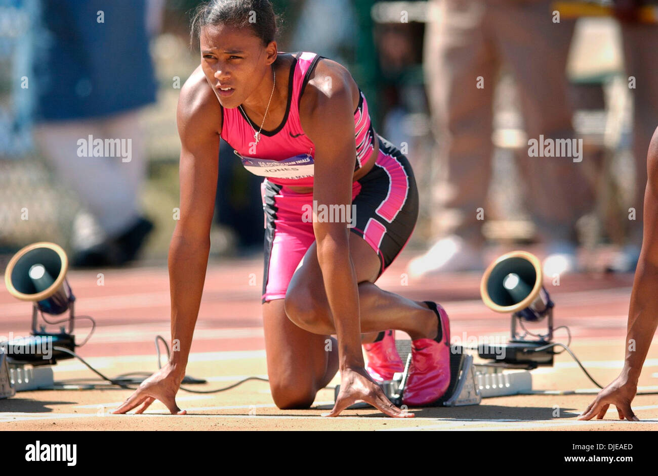 Jul 09, 2004; Sacramento, CA, USA; MARION JONES looks down the track ...