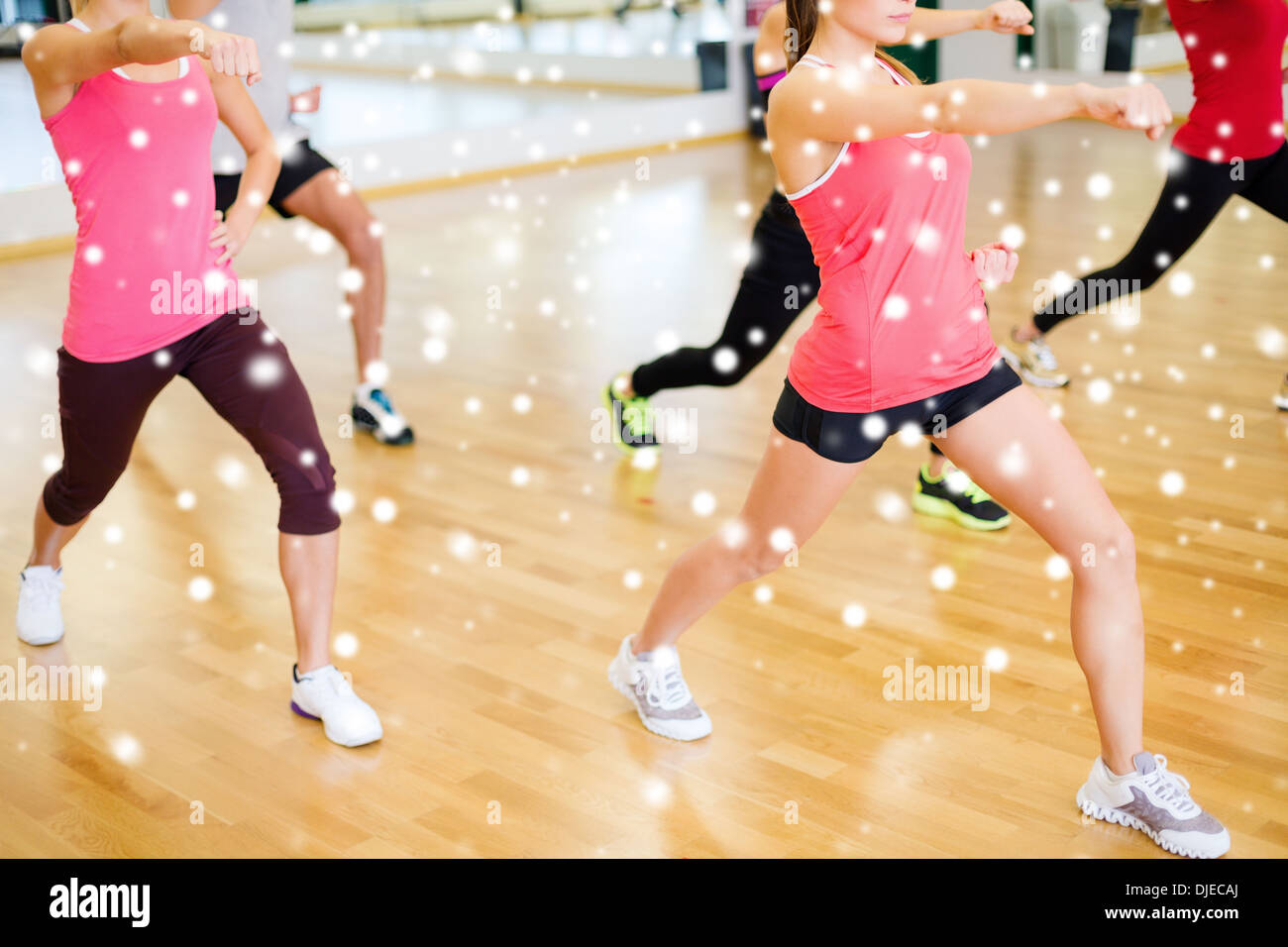 group of smiling people exercising in the gym Stock Photo - Alamy