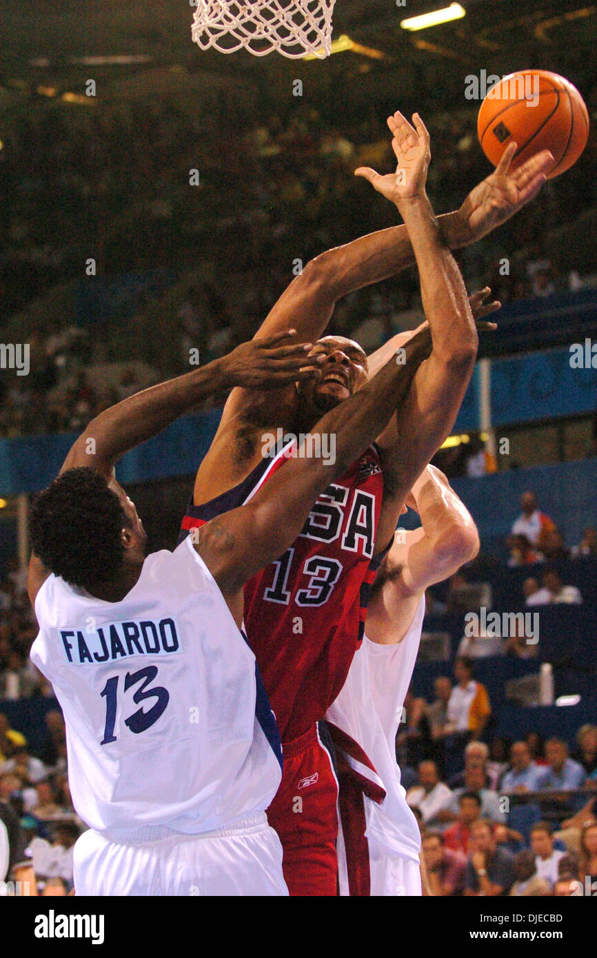 Aug 15, 2004; Athens, GREECE; USA 's Tim Duncan gets tied-up Sunday ...
