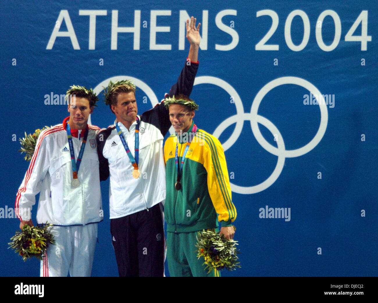 Aug 20, 2004; Athens, GREECE; U.S. Olympic swimmer GARY HALL (C) waves ...