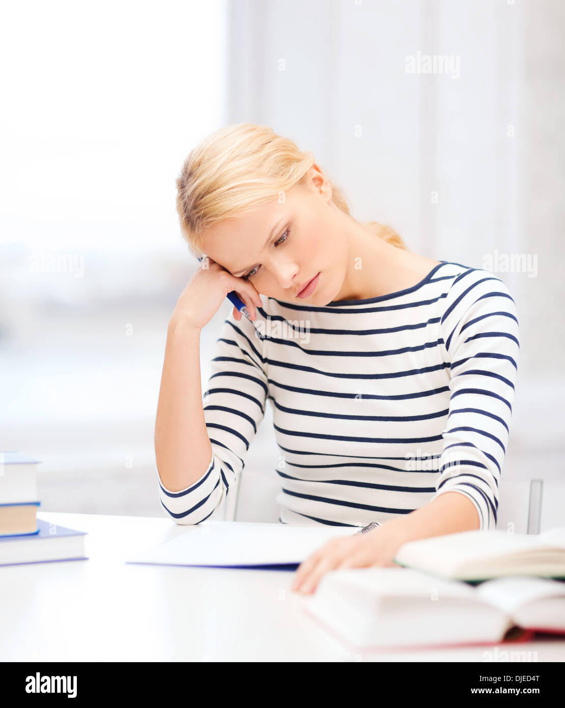 concentrated woman studying in college Stock Photo - Alamy