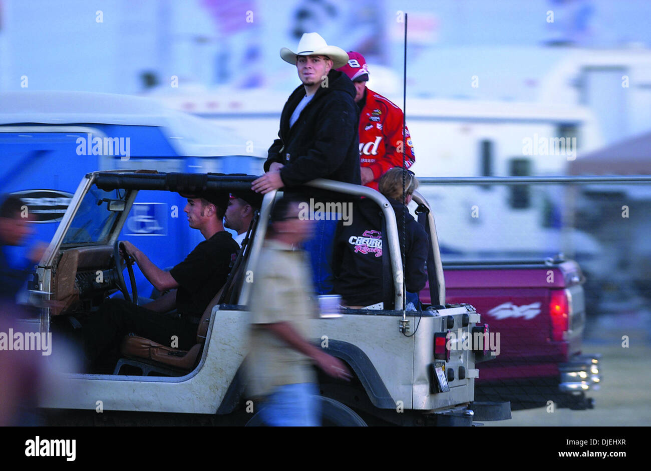 NASCAR fans ride around the grounds of ''50 Acres'',an RV parking lot ...