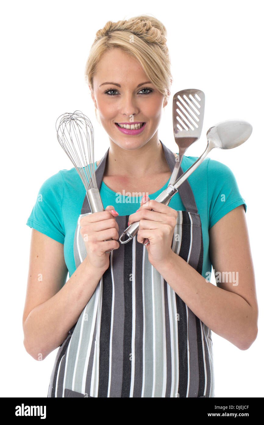 Model Released. Attractive Young Woman Holding Stainless Steel Kitchen ...
