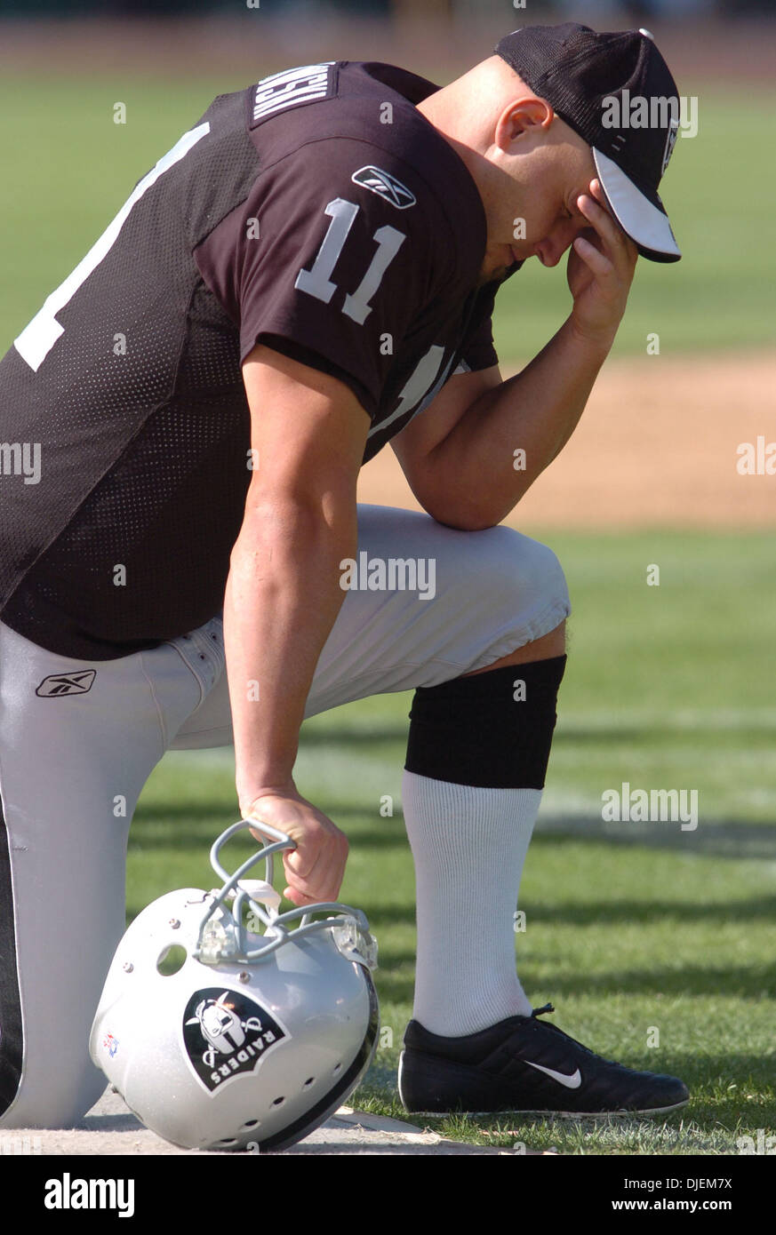 Oakland Raiders Sebastian Janikowski can't watch the closing seconds of ...