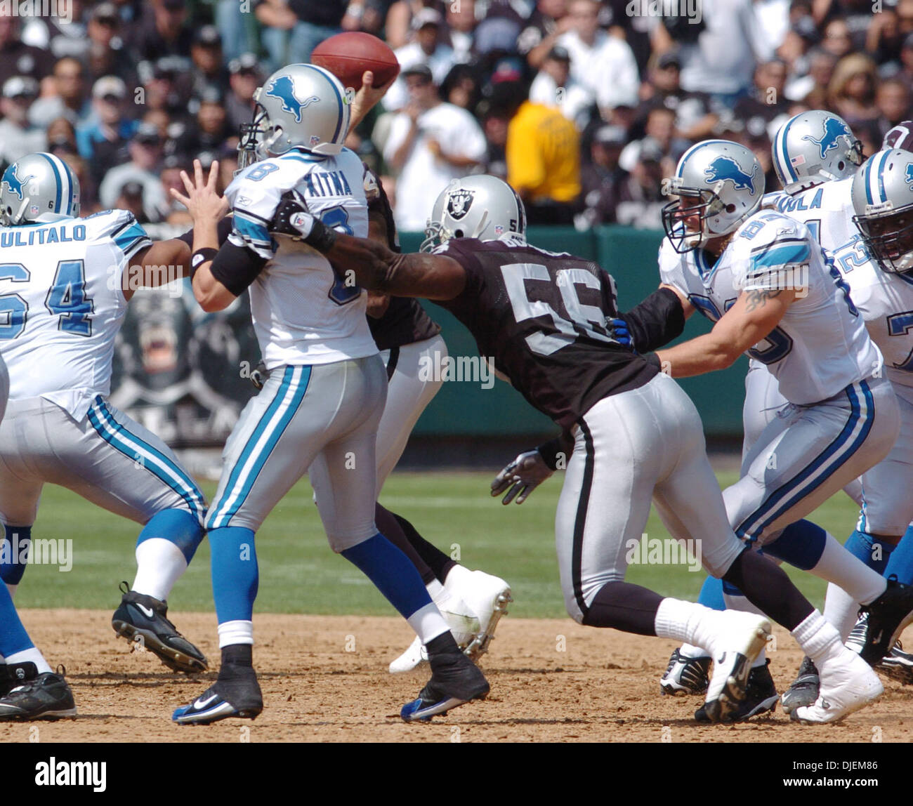 Detroit Lions quarterback Jon Kitna gets the ball off as Oakland ...