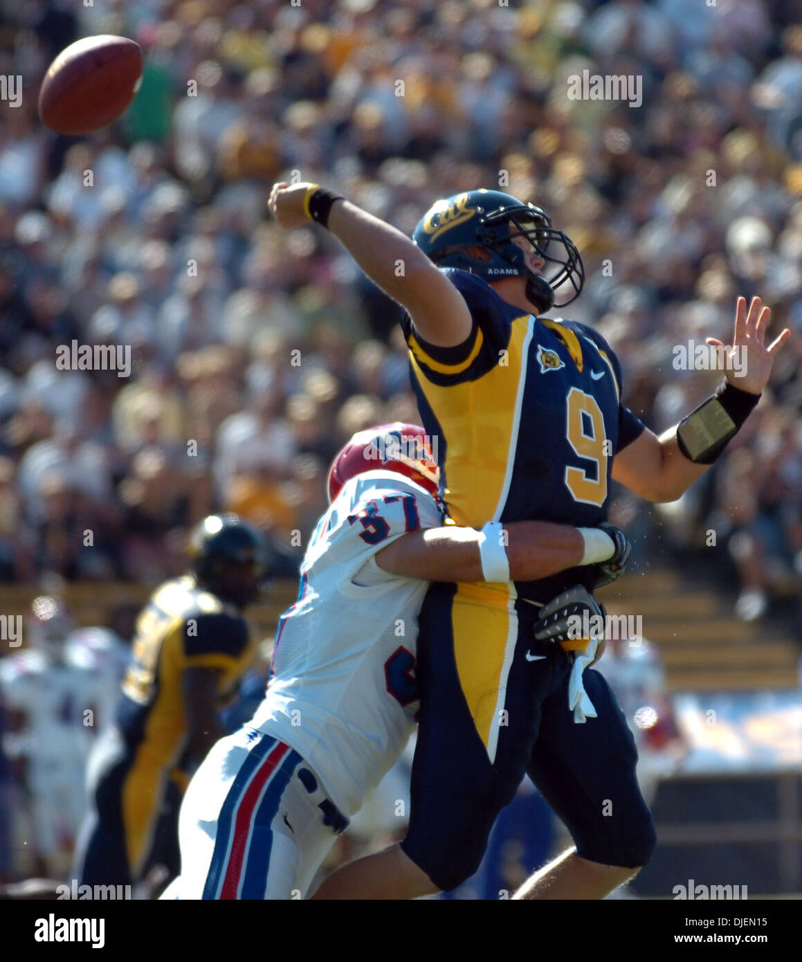 California quarterback Nate Longshore has the ball knocked out of his ...