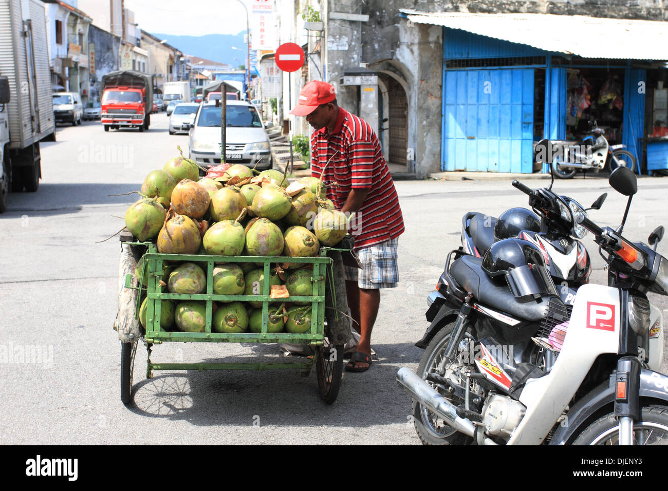 a man selling fresh coconut on road, komtar,penang,Malaysia Stock Photo ...