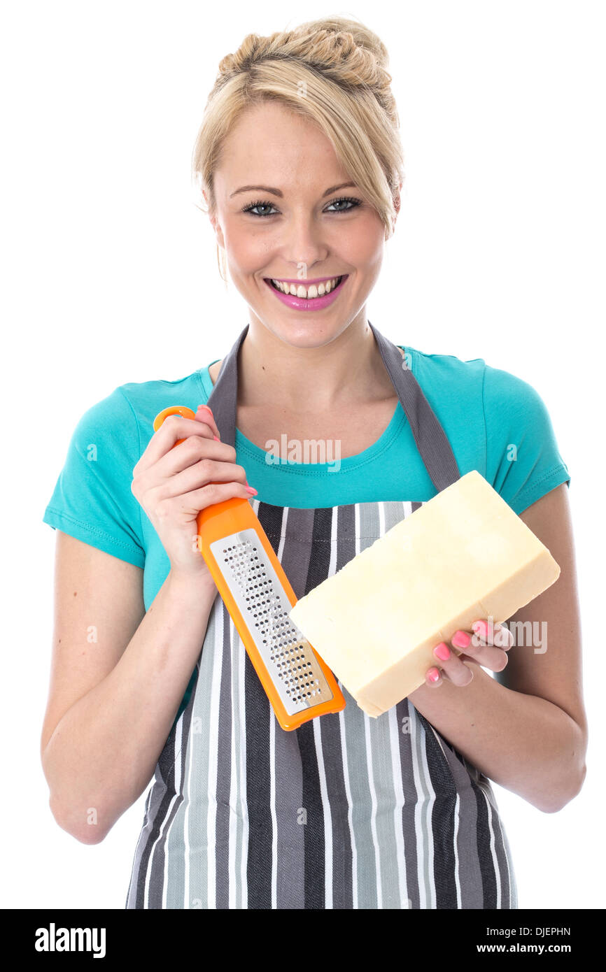 Model Released. Attractive Young Woman Grating Cheese Stock Photo - Alamy