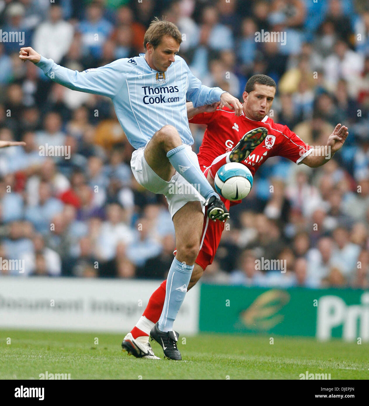 Dietmar Hamman of Manchester City challenges for posession with Fabio ...
