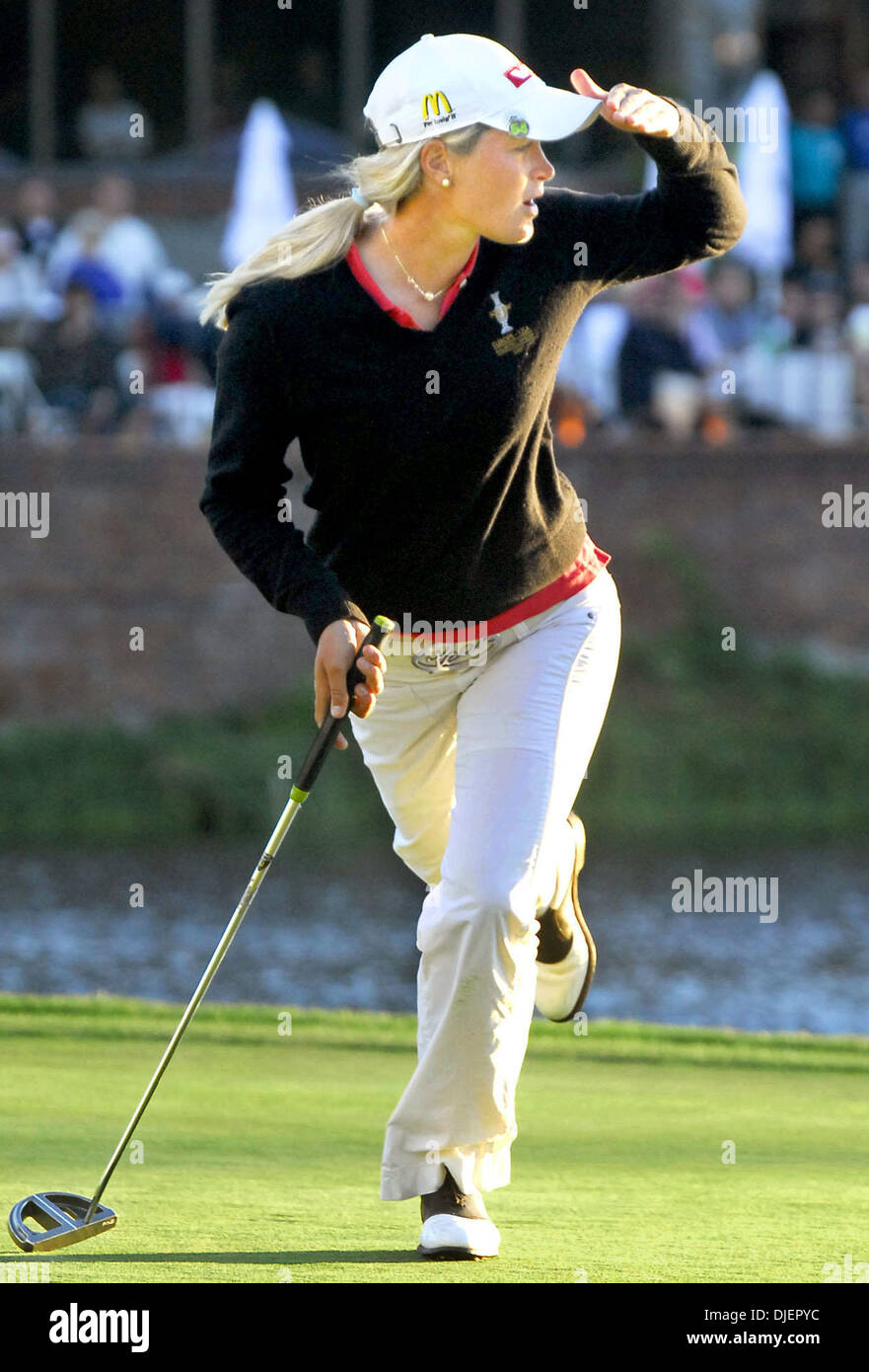 Suzann Pettersen watches her putt on the 18th hole during the LPGA ...