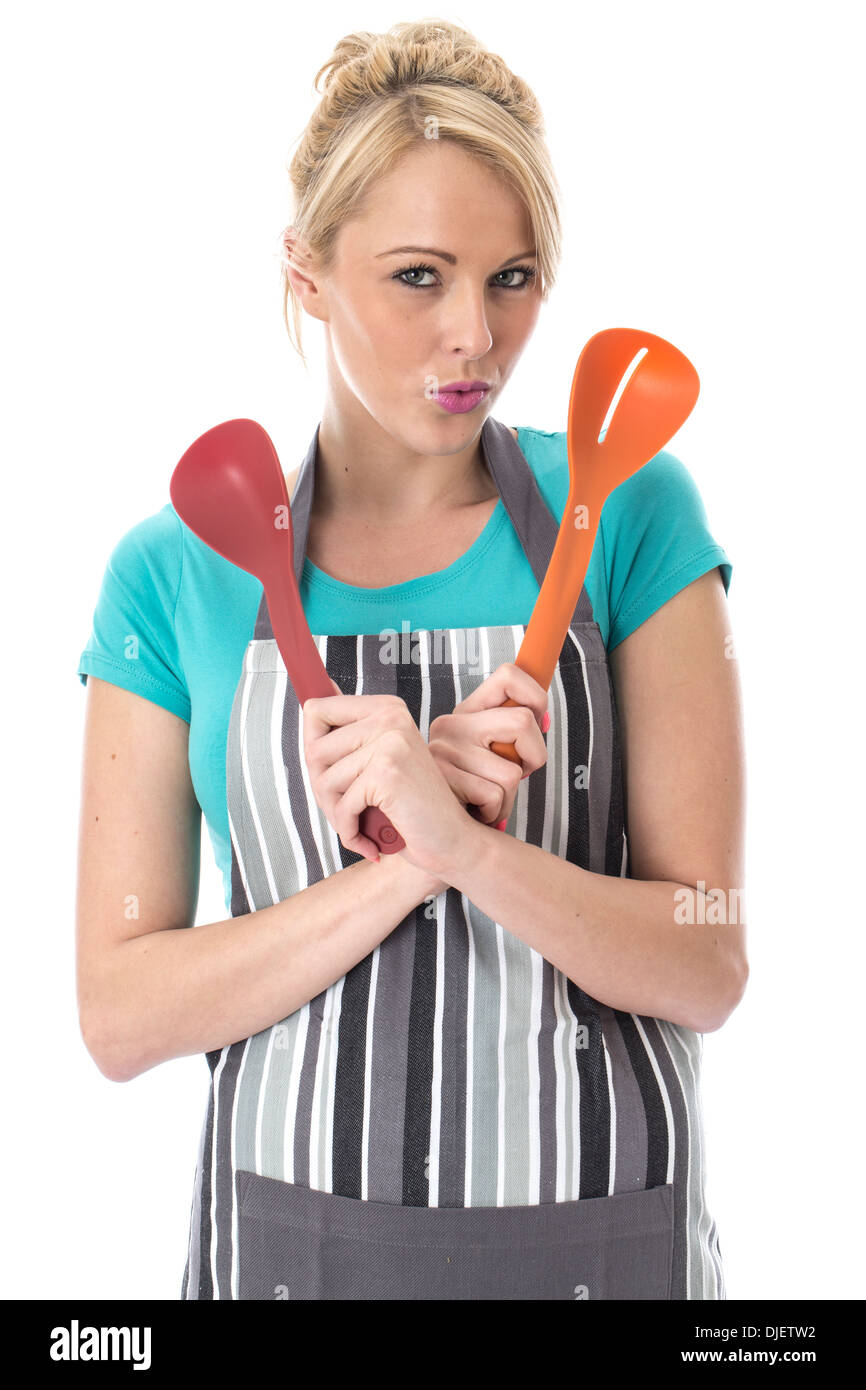 Model Released. Attractive Young Woman Holding Plastic Serving Spoons ...