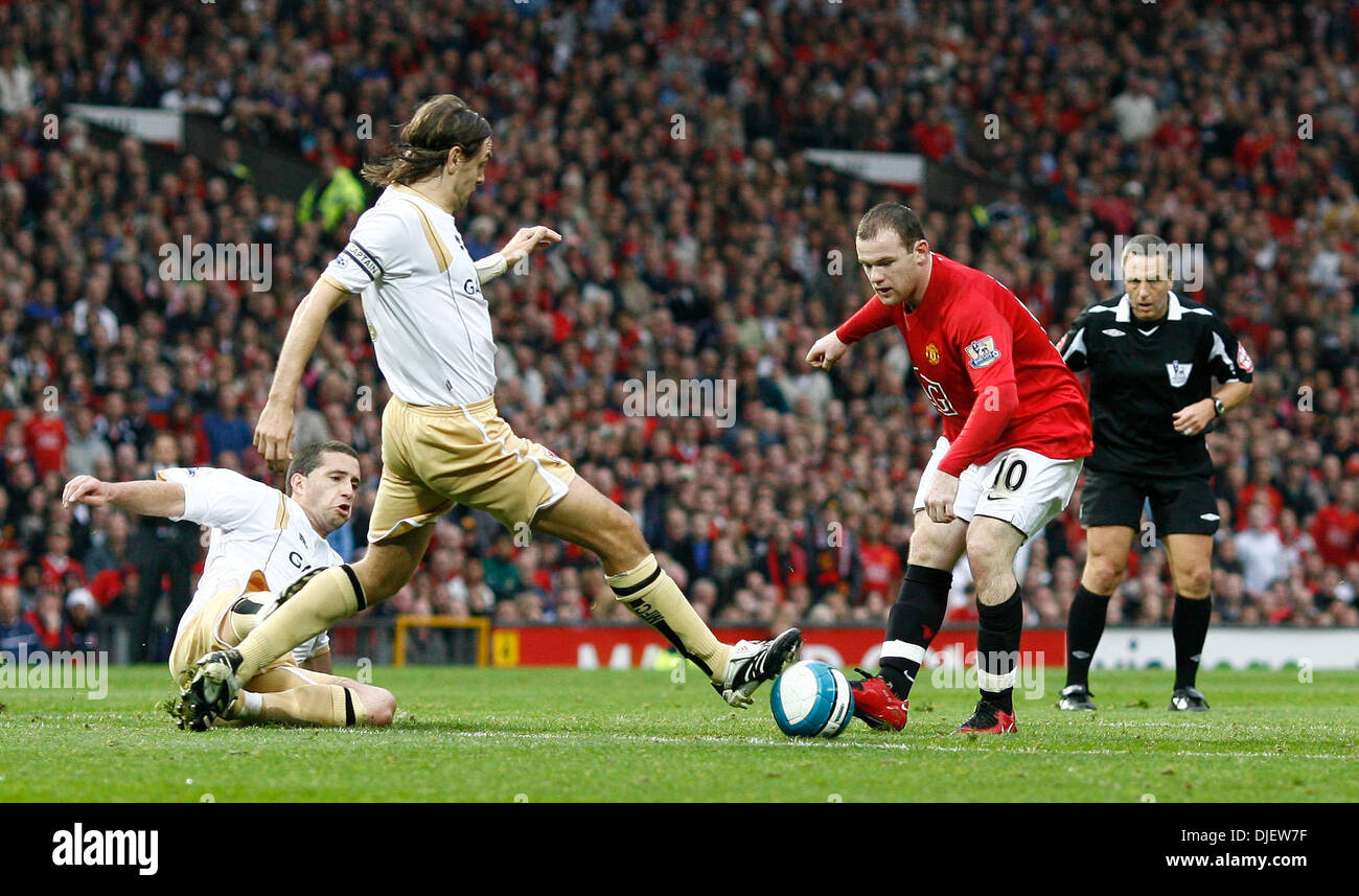 Wayne Rooney of Manchester United has his shot blocked by Jonathan ...