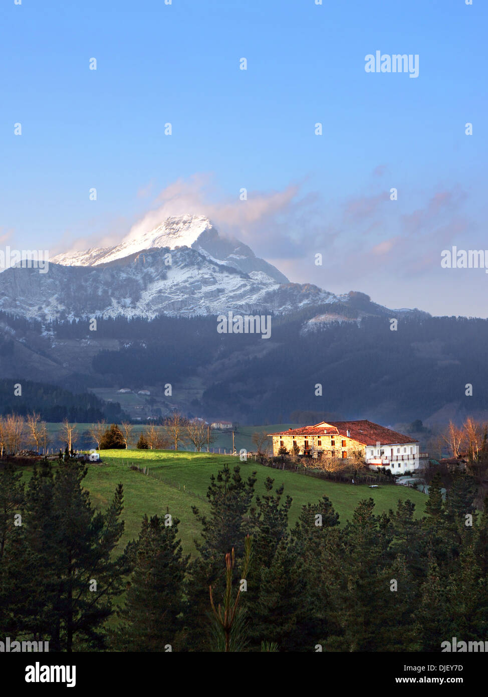 typical basque country house in Aramaio valley surrounding by mountains ...