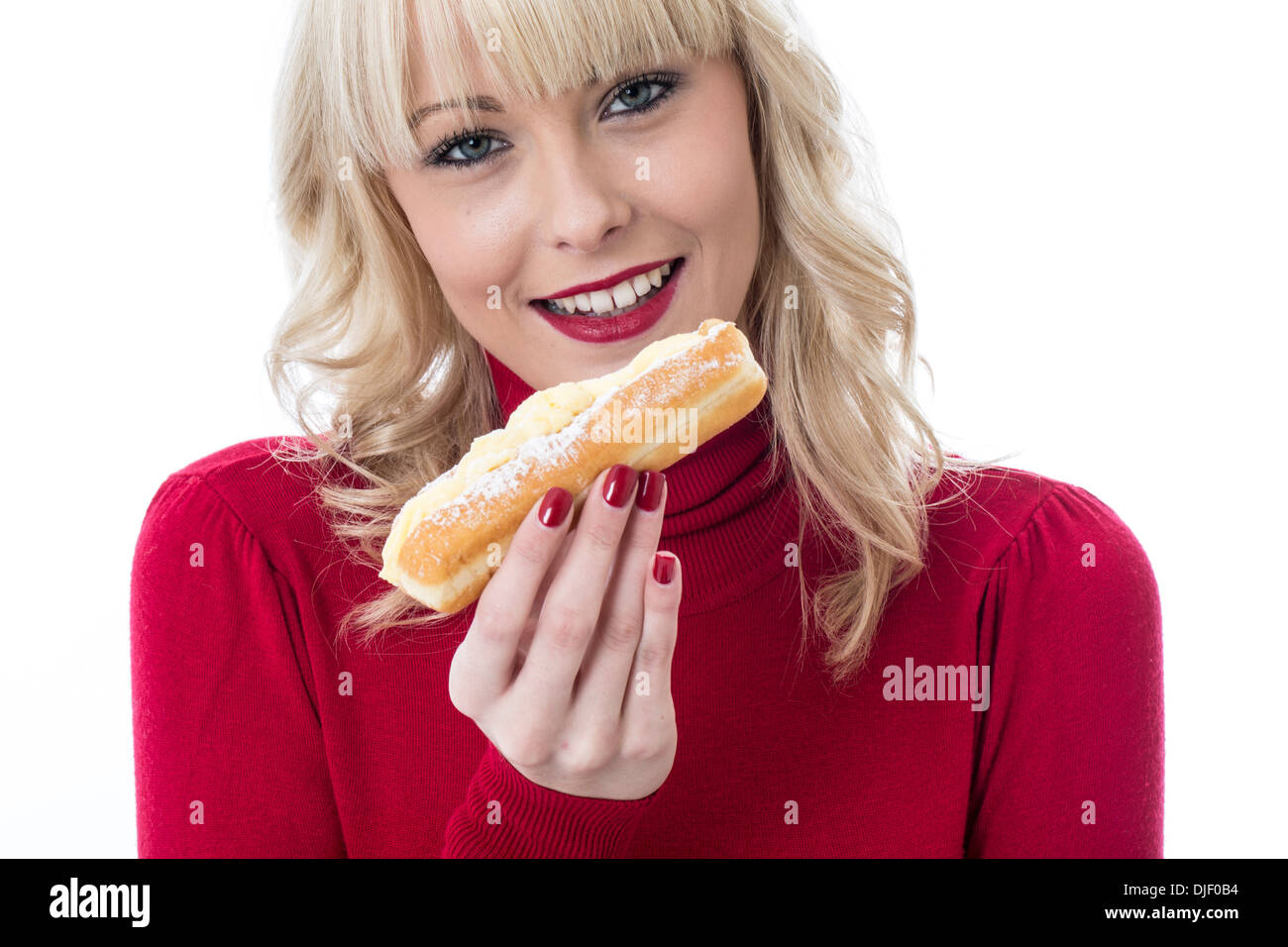 Model Released. Attractive Young Woman Eating a Cream Cake Stock Photo ...