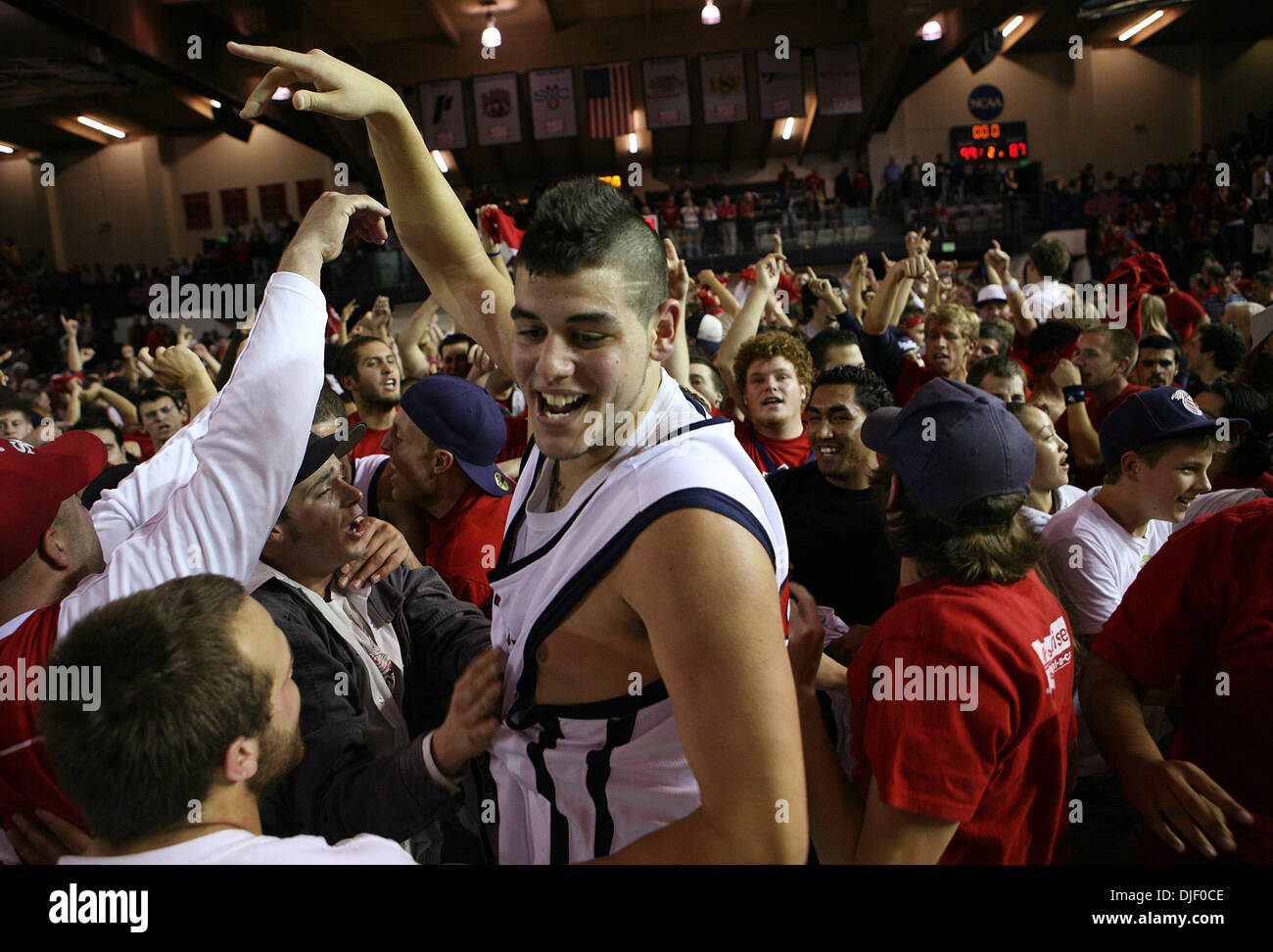 Saint Mary's Gaels' Omar Samhan, #50, celebrates with the fans as they ...