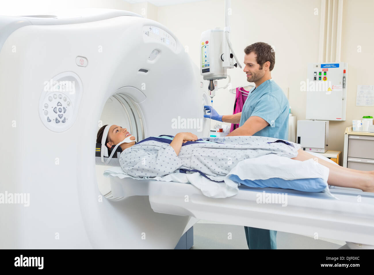 Nurse Preparing Patient For CT Scan In Hospital Stock Photo - Alamy