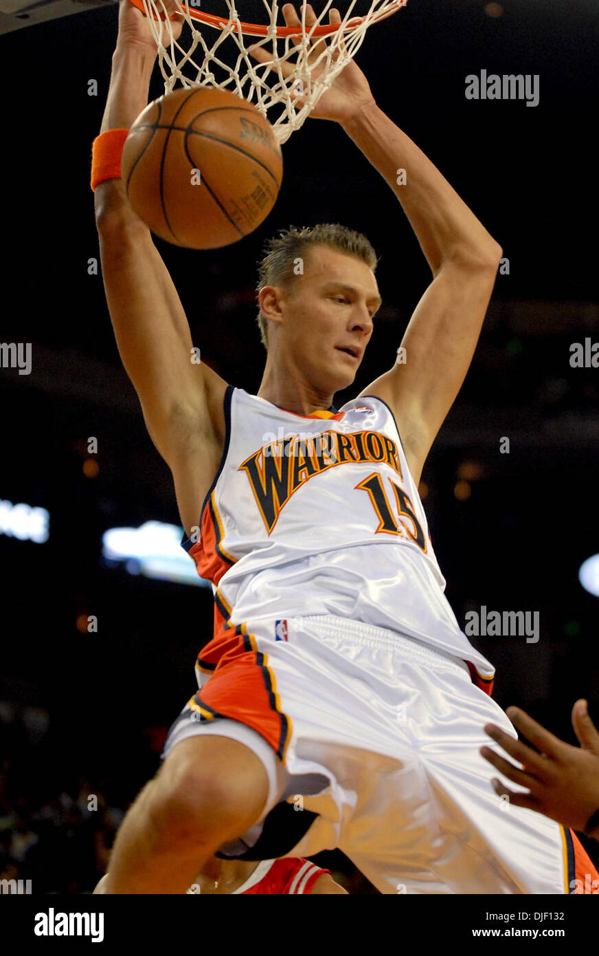 Warriors center Andris Biedrins slams a basket during their game ...