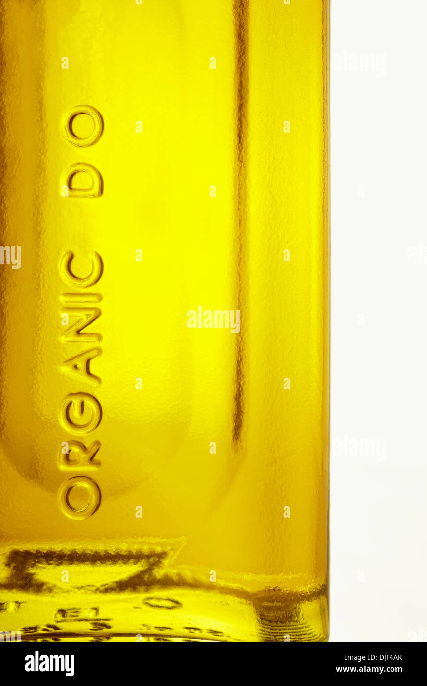 Organic olive oil bottle with the denomination of origin sign on white ...
