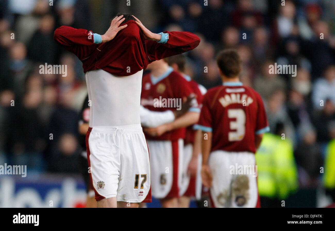 Kyle Lafferty of Burnley hides his head after being sent off for a ...