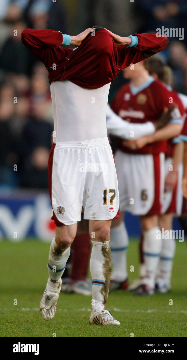 Kyle Lafferty of Burnley hides his head after being sent off for a ...