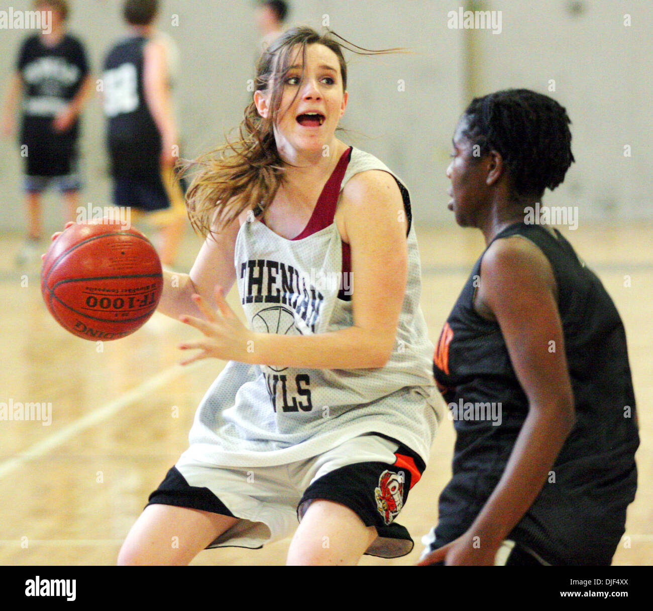 Alison Wall looks for a passing lane around Jesse Ewing during practice ...