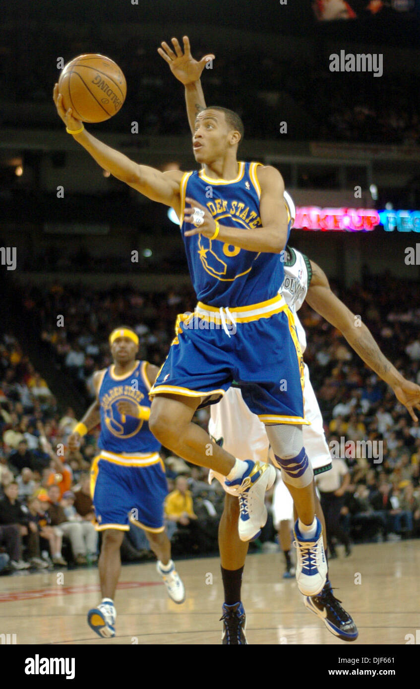 Warriors guard Monta Ellis scores a layup after getting under ...