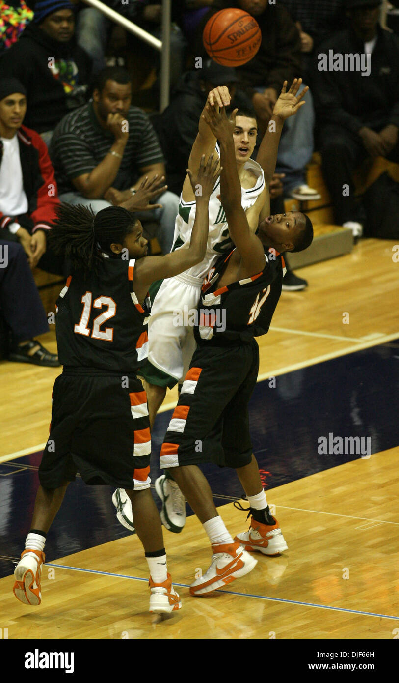 De La Salle High School's Jose Rivera, center, passes over a double ...