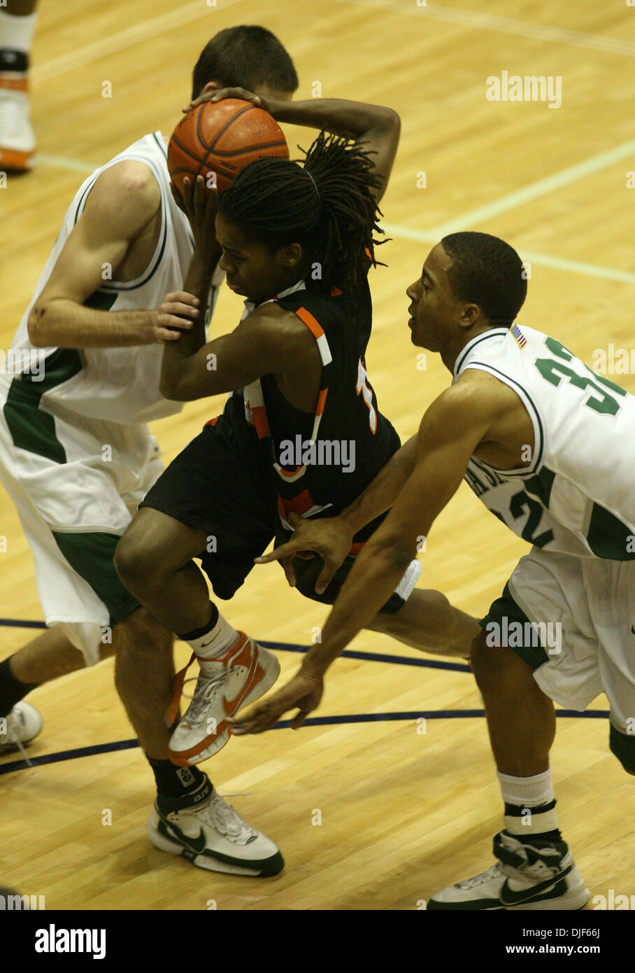 McClymonds High School's Damario Sims, center, drives to the basket ...