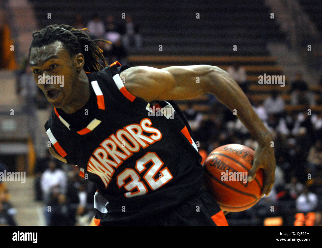McClymonds' Damon Powell (#32) goes around the back for two points ...