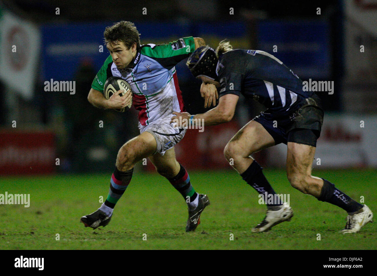 Adrian Jarvis of Harlequins gets clear of Magnus Lund of Sale Sharks ...