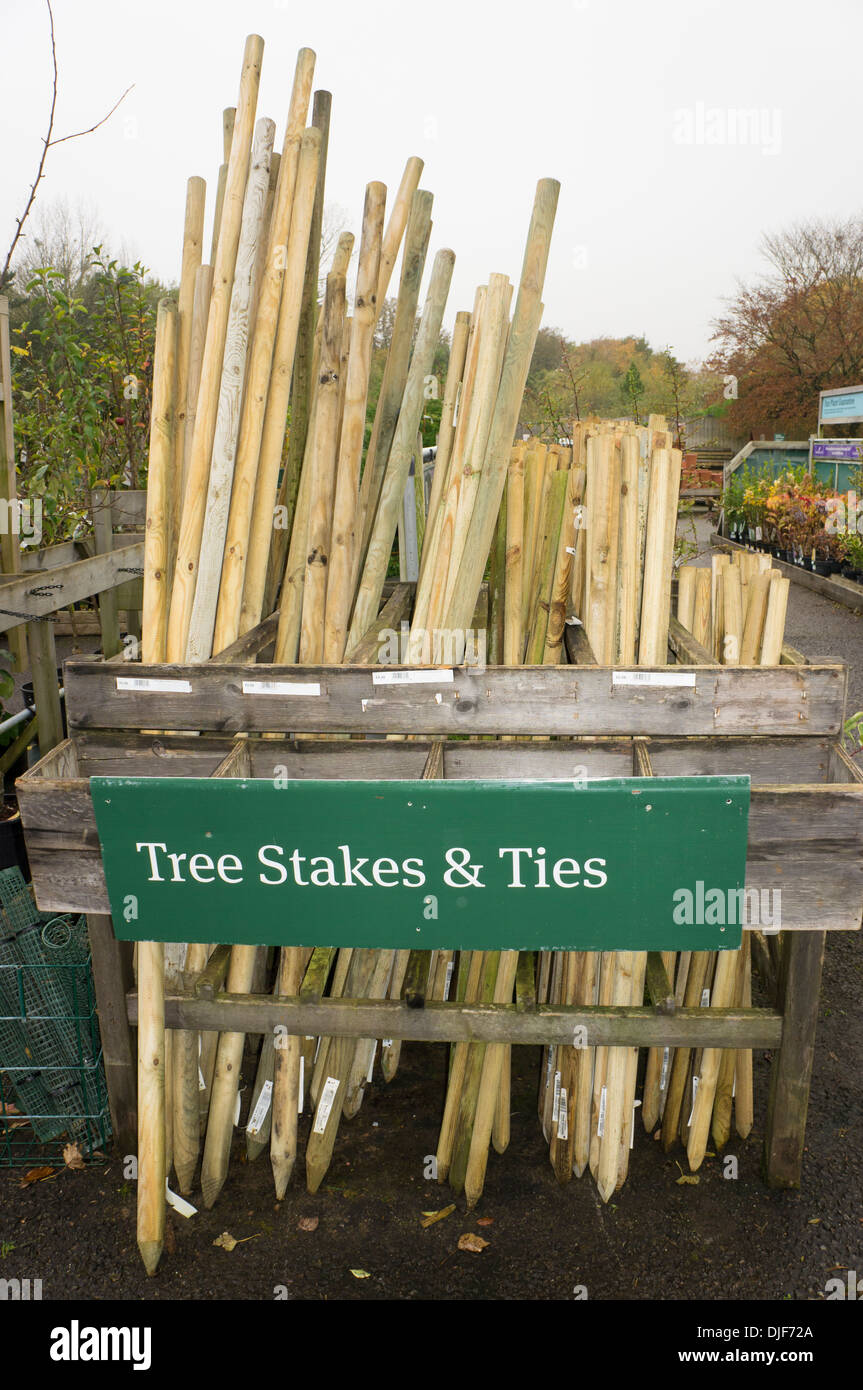 Garden center tree stakes for sale display Stock Photo - Alamy