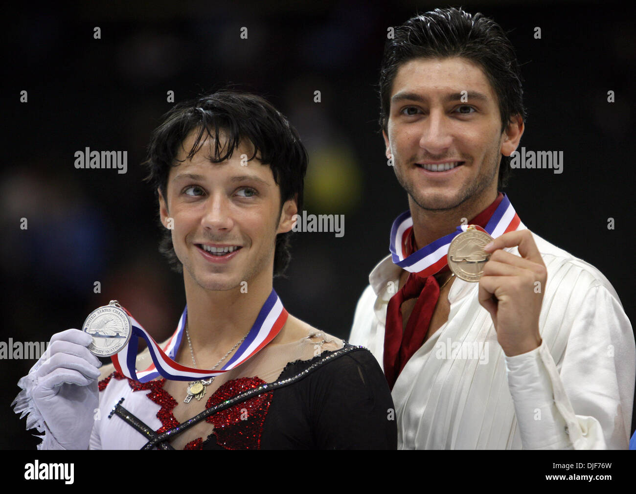 Johnny Weir, left, and Evan Lysacek show their medals following the men ...