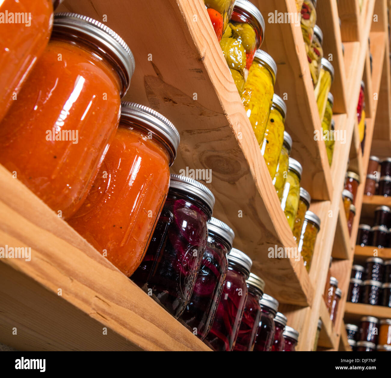 Canned goods on wooden storage shelves in pantry Stock Photo - Alamy